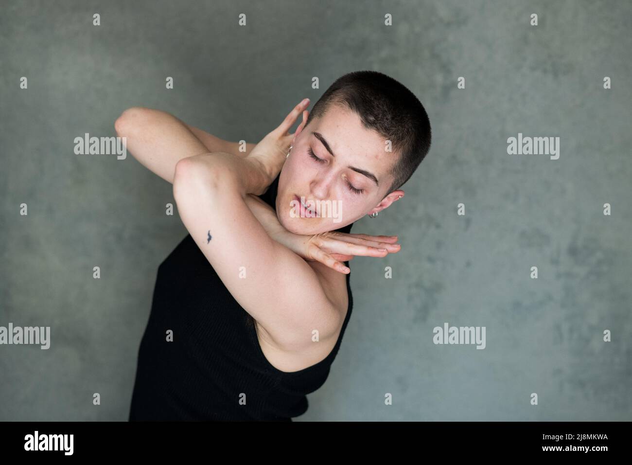 non binary pulling an angry, frustrated face Stock Photo - Alamy