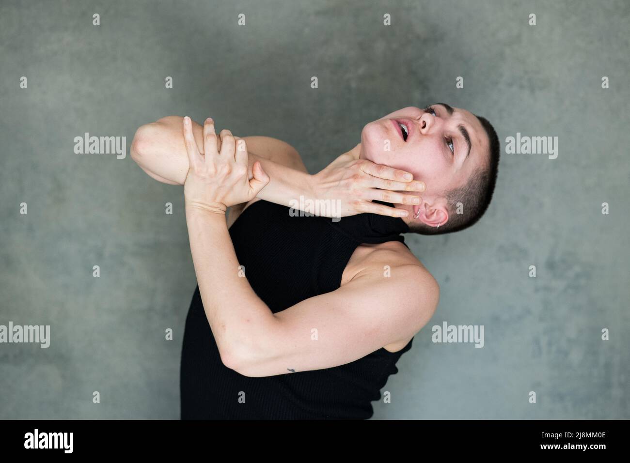 non binary pulling an angry, frustrated face Stock Photo - Alamy