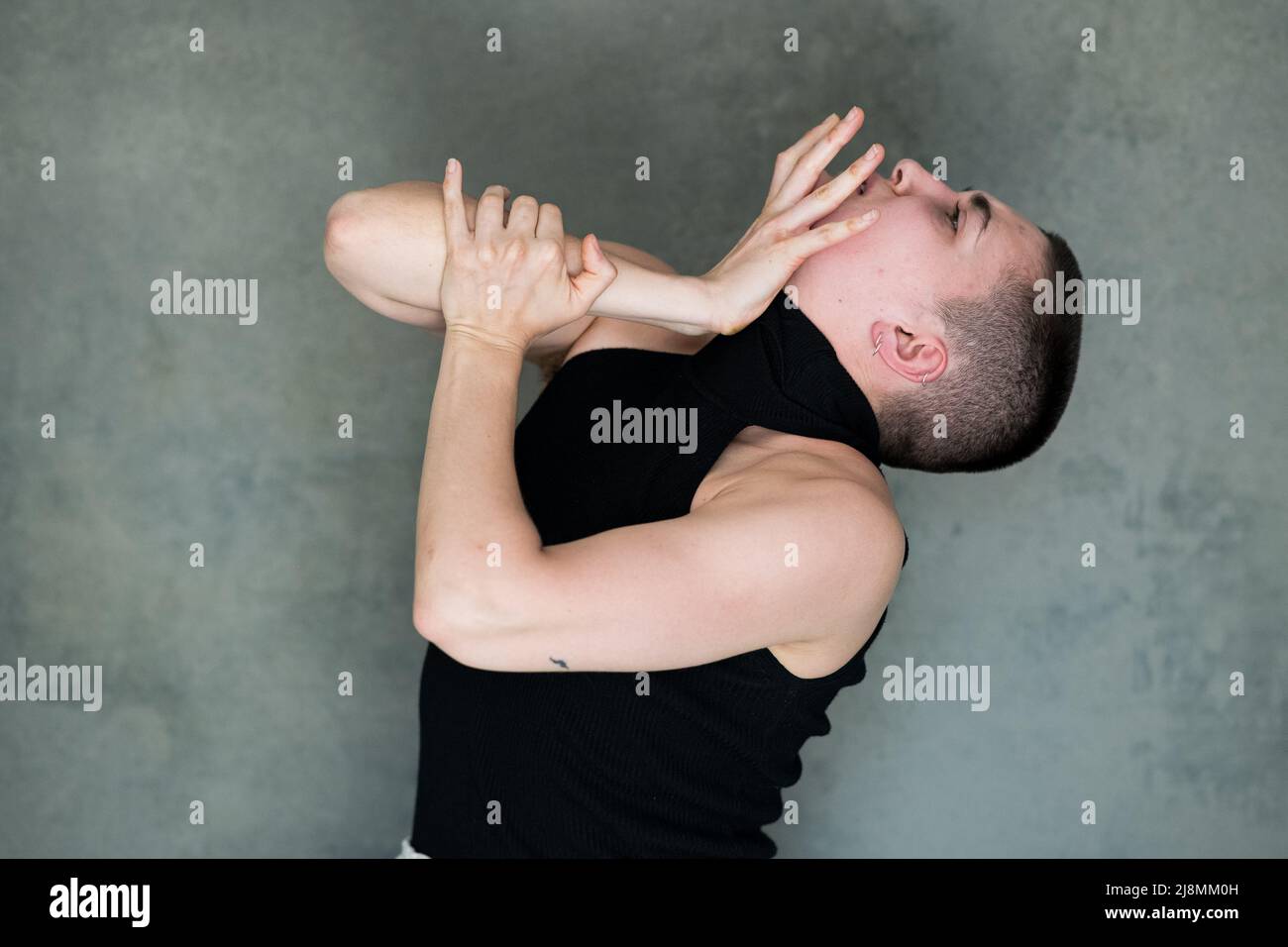non binary pulling an angry, frustrated face Stock Photo - Alamy