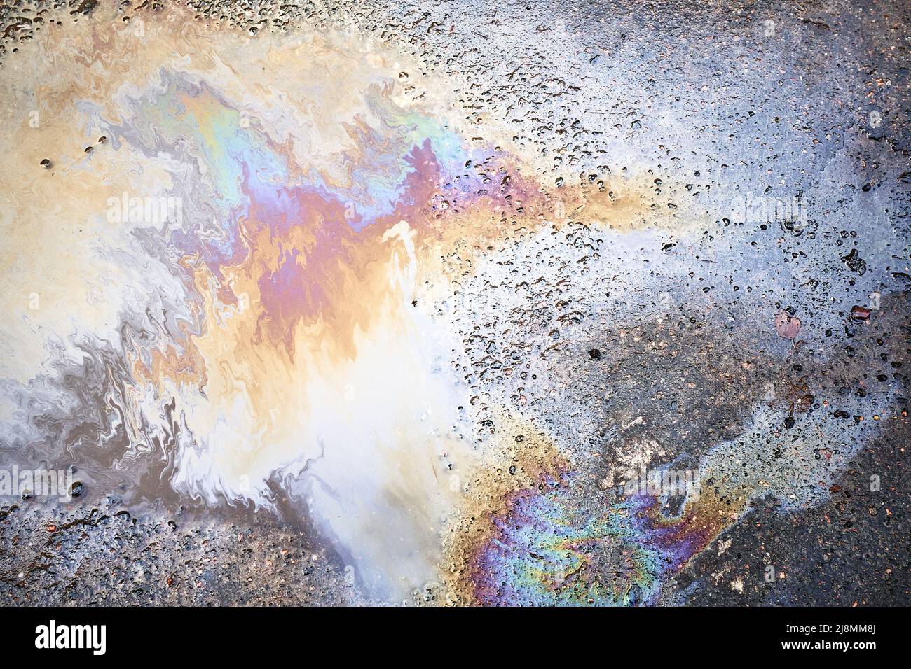 Gasoline oil spill on the pavement as a texture or background Stock ...