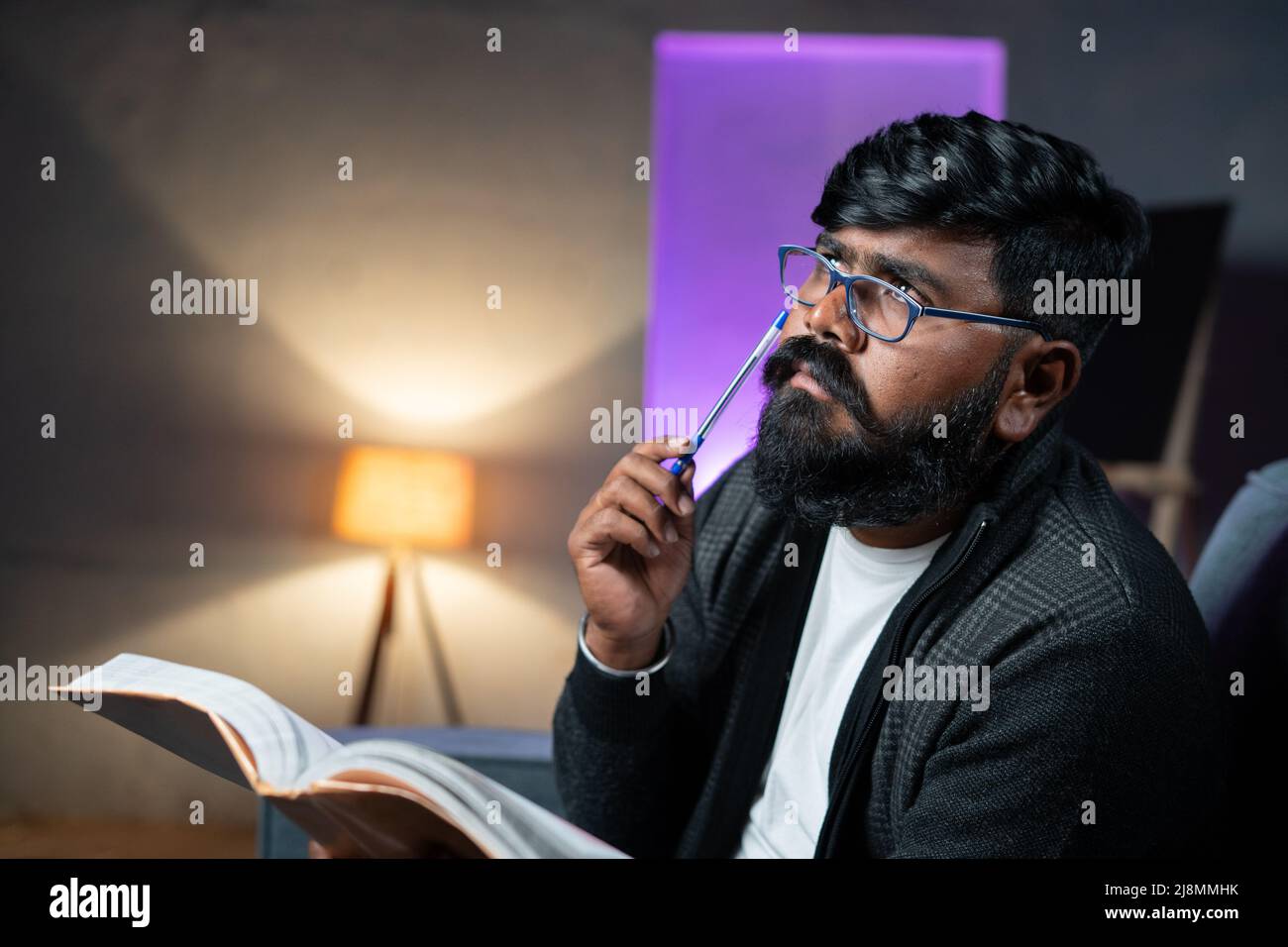 Close up confused man reading book hi-res stock photography and images ...