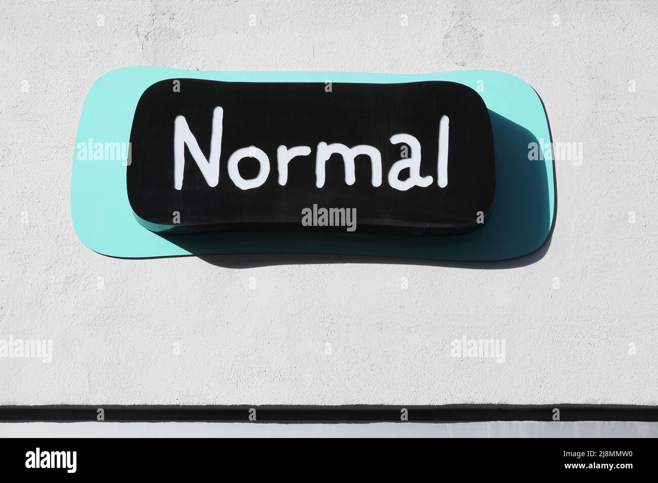 Aarhus, Denmark - March 4, 2022: Normal logo on a wall. Normal is a ...