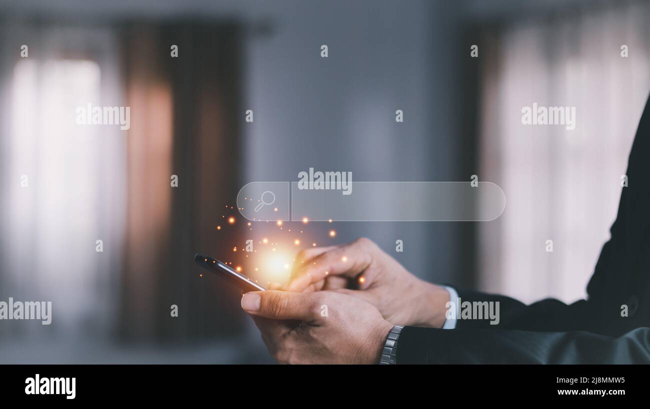 Data Search Technology Search Engine Optimization. man's hands are using a computer notebook to ...