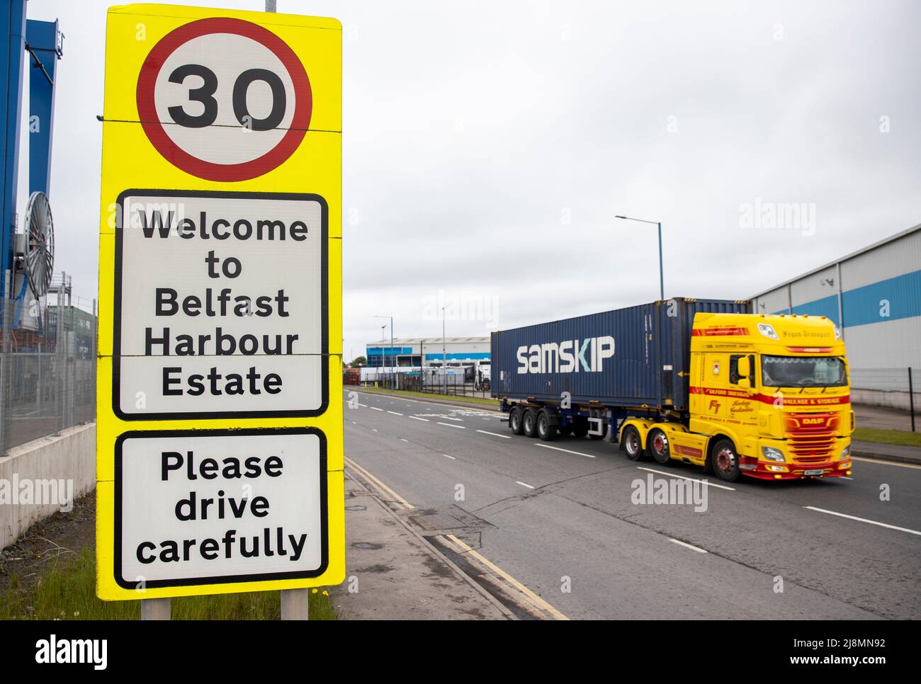 Haulage lorry drives passed a sign at Belfast Port welcoming travellers ...
