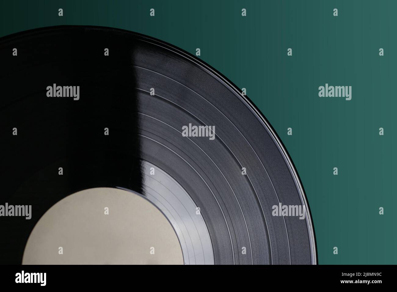 Classic vinyl record close-up on a green background, classical music ...