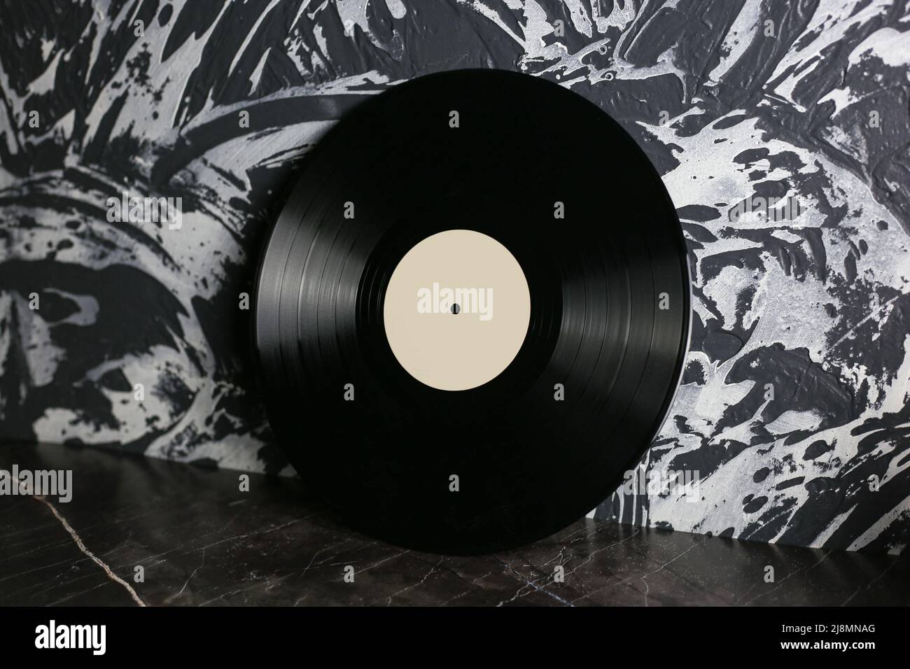 Classic vinyl record close up on a light background, outdated data ...