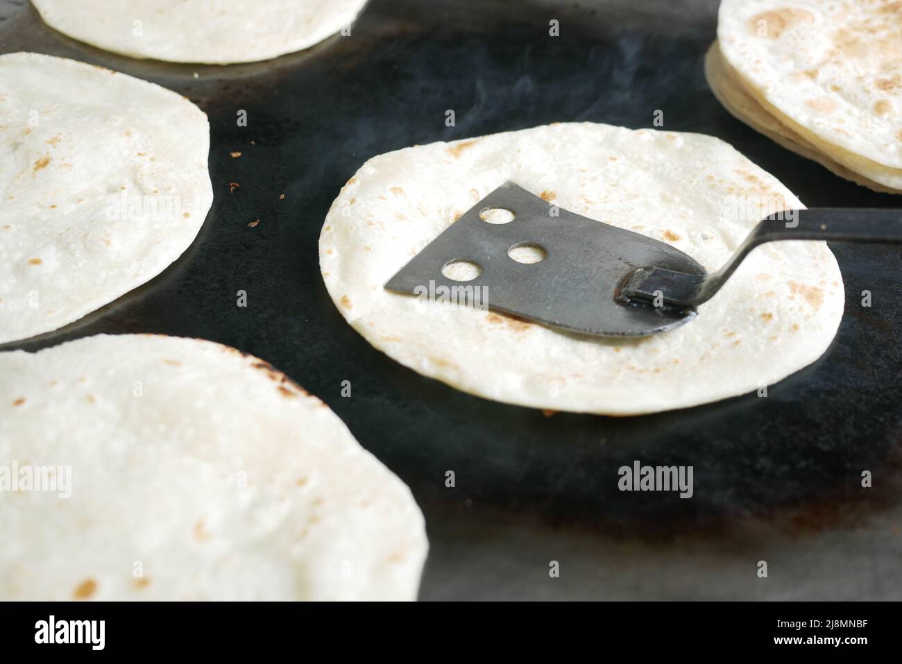 cooking homemade roti chapati close up Stock Photo - Alamy