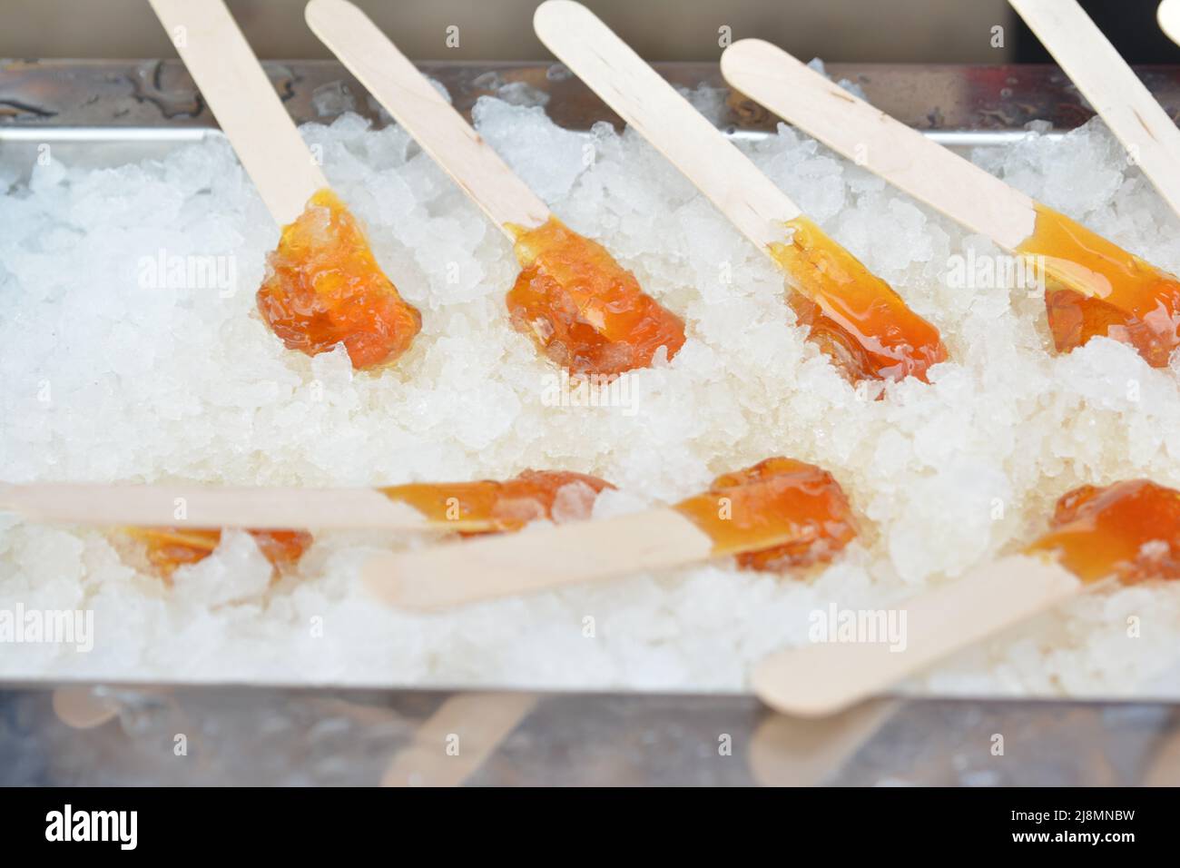 Making sugar on snow in Canada. Maple syrup Stock Photo - Alamy