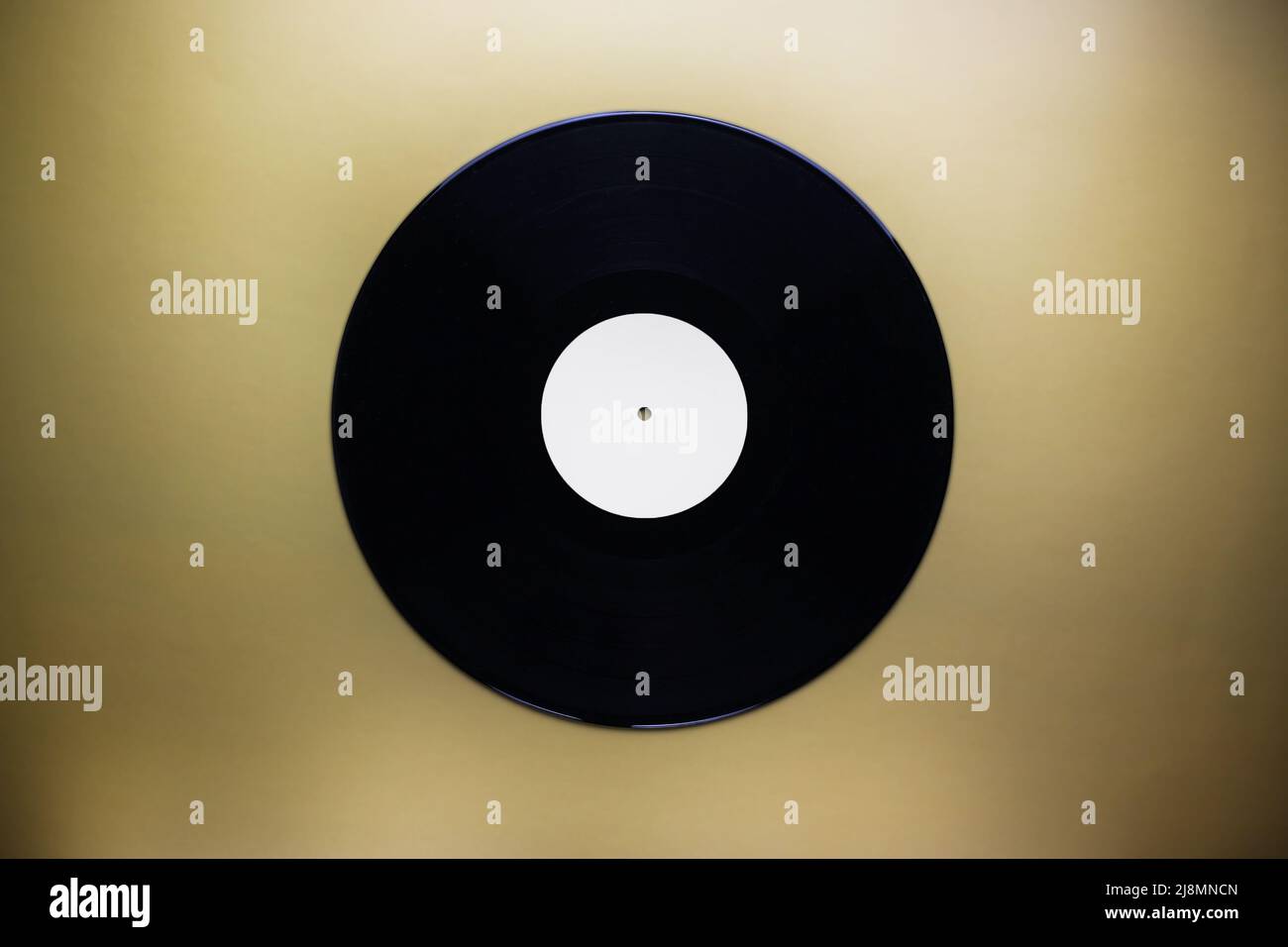 Classic vinyl record close-up on a yellow background, obsolete data ...