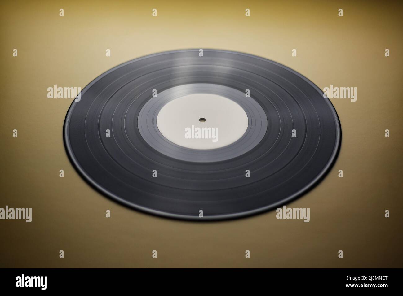 Classic vinyl record close-up on a yellow background, obsolete data ...