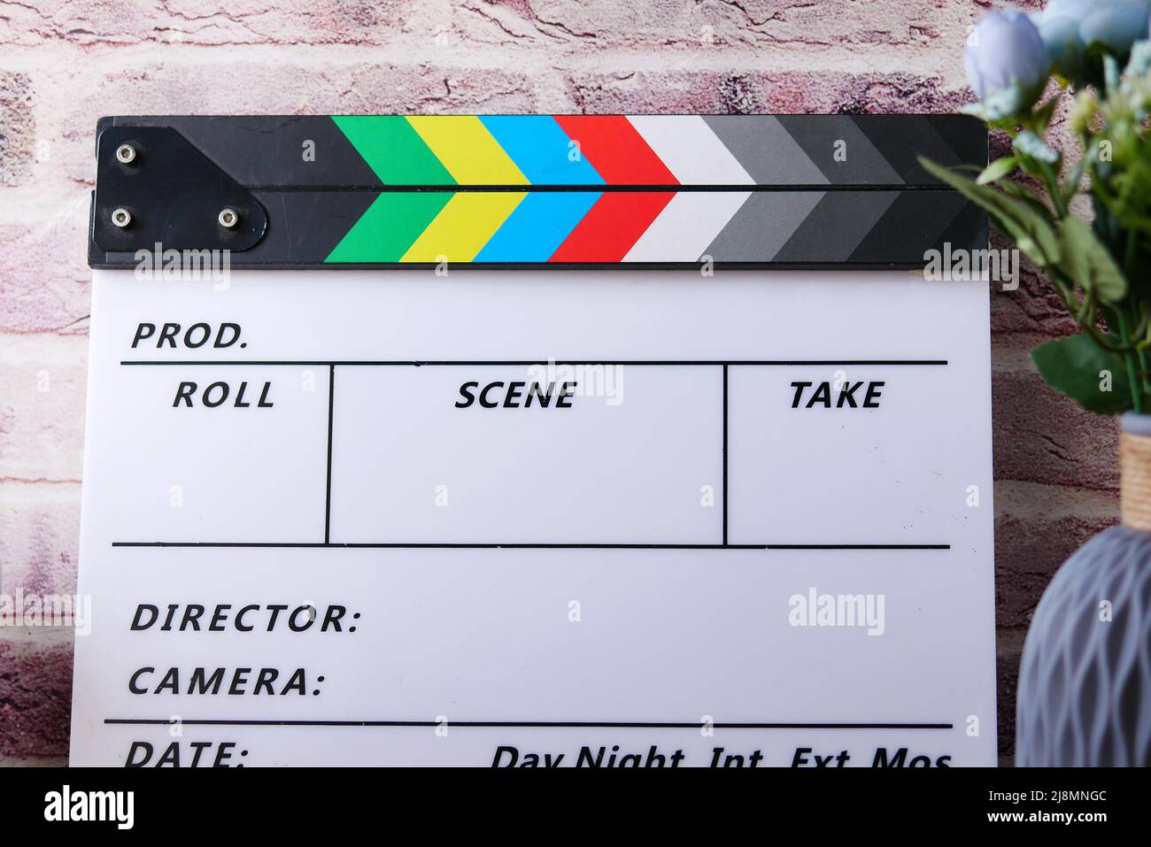 Movie clapper board against white wall Stock Photo - Alamy