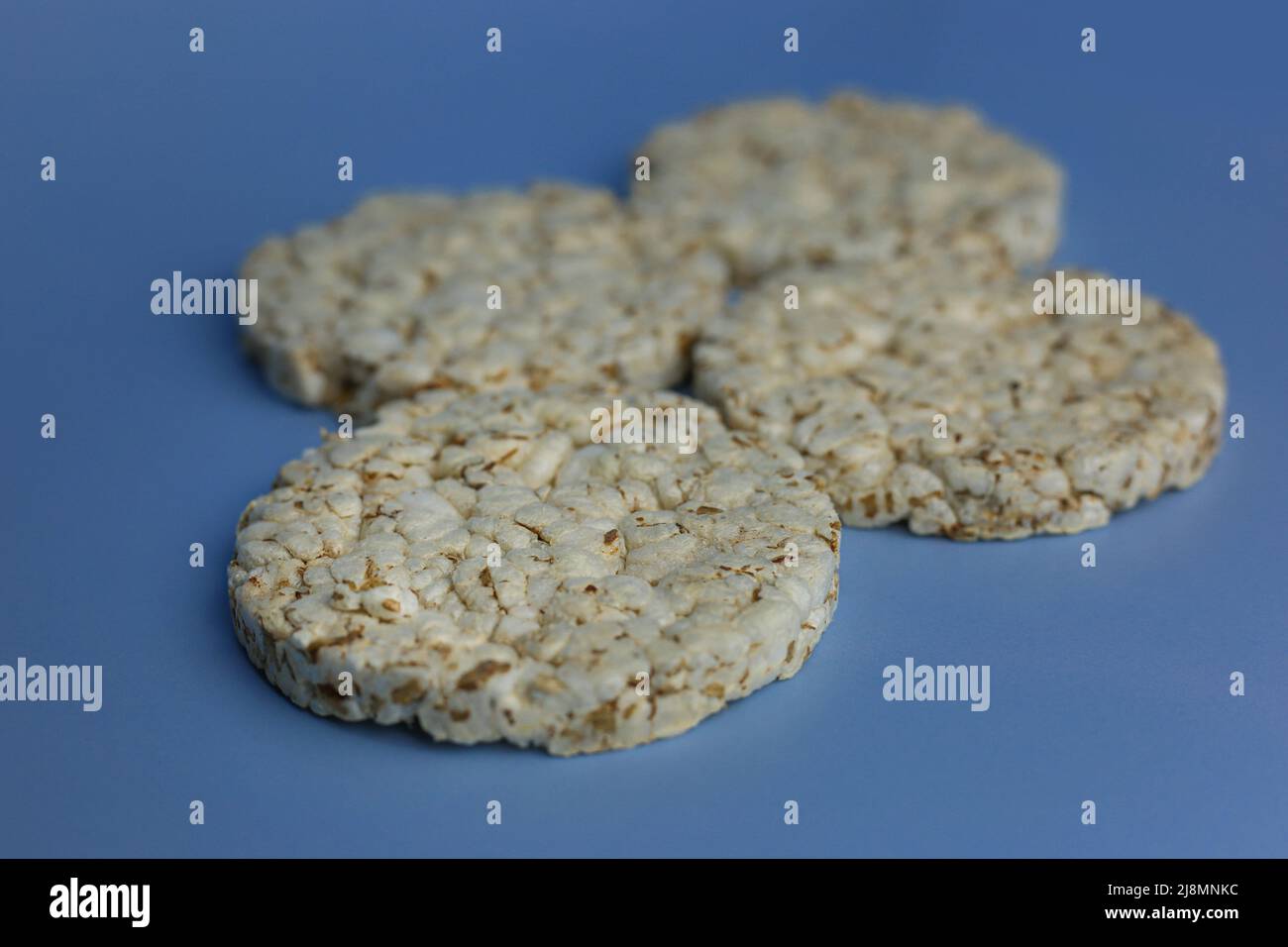 Rice buckwheat crispbread on an isolated blue background close-up Stock ...