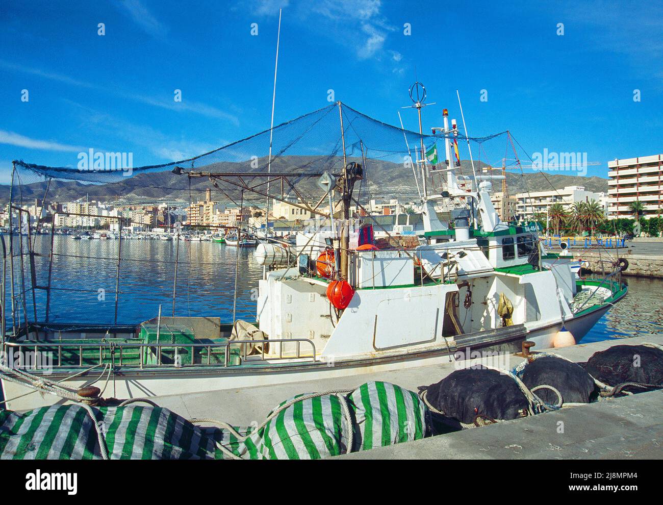 Fishing boat and overview of the village. Adra, Almeria province ...