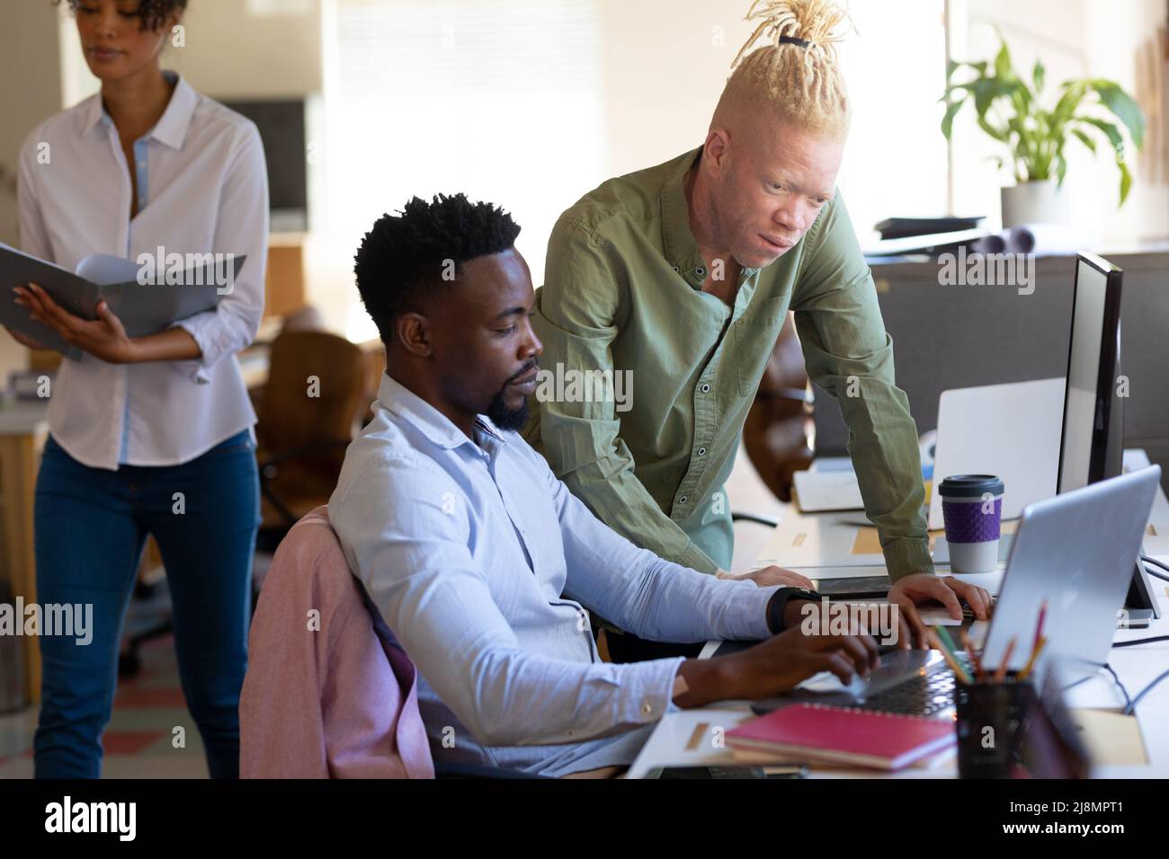 Colleague assisting business team hi-res stock photography and images ...