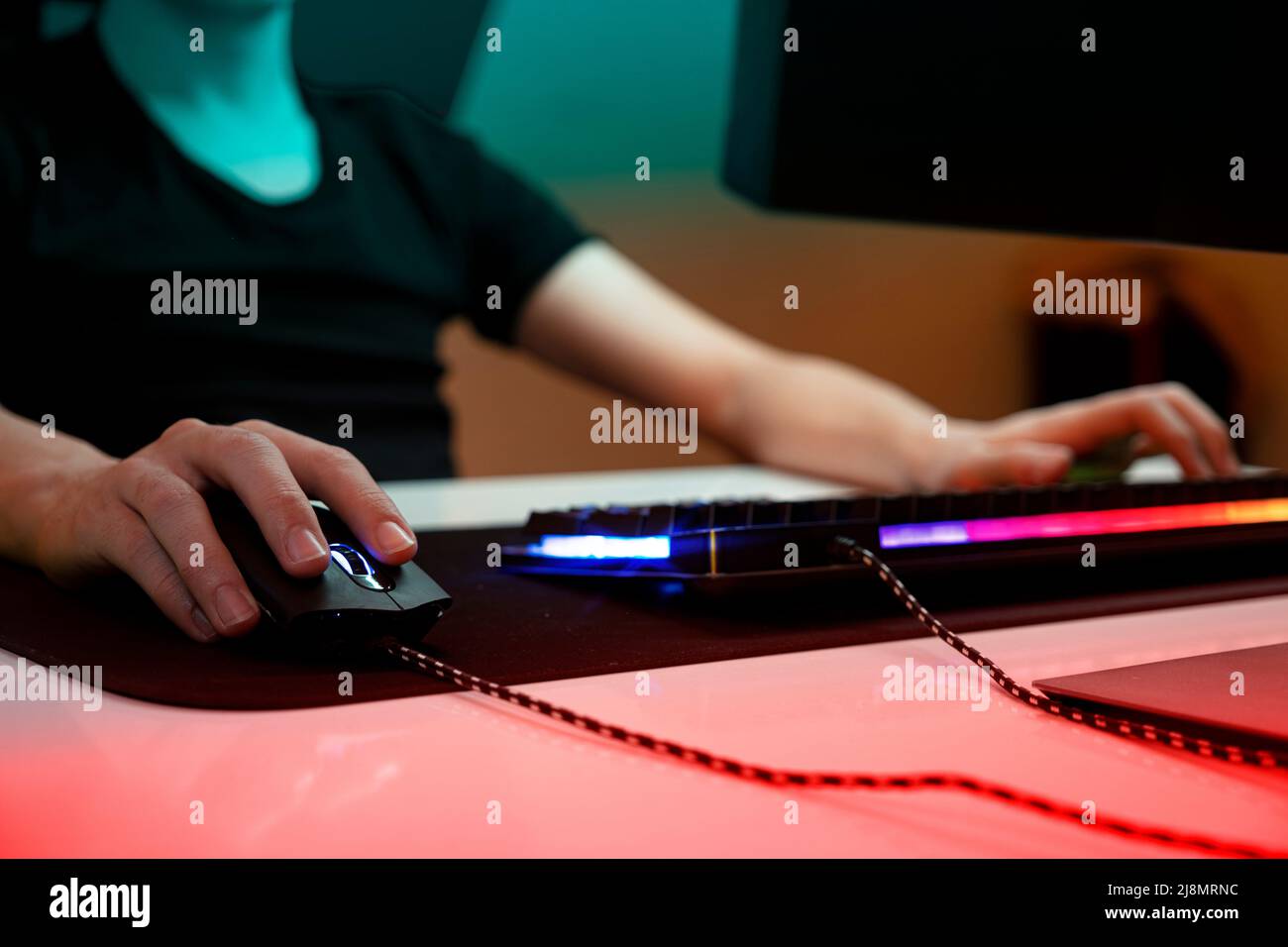 Hands on mouse, selective focus to young gamers hands on mouse. At ...