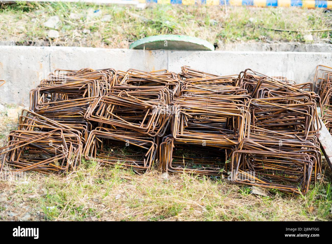 Pan shot of building bent iron rods near home construction place Stock ...