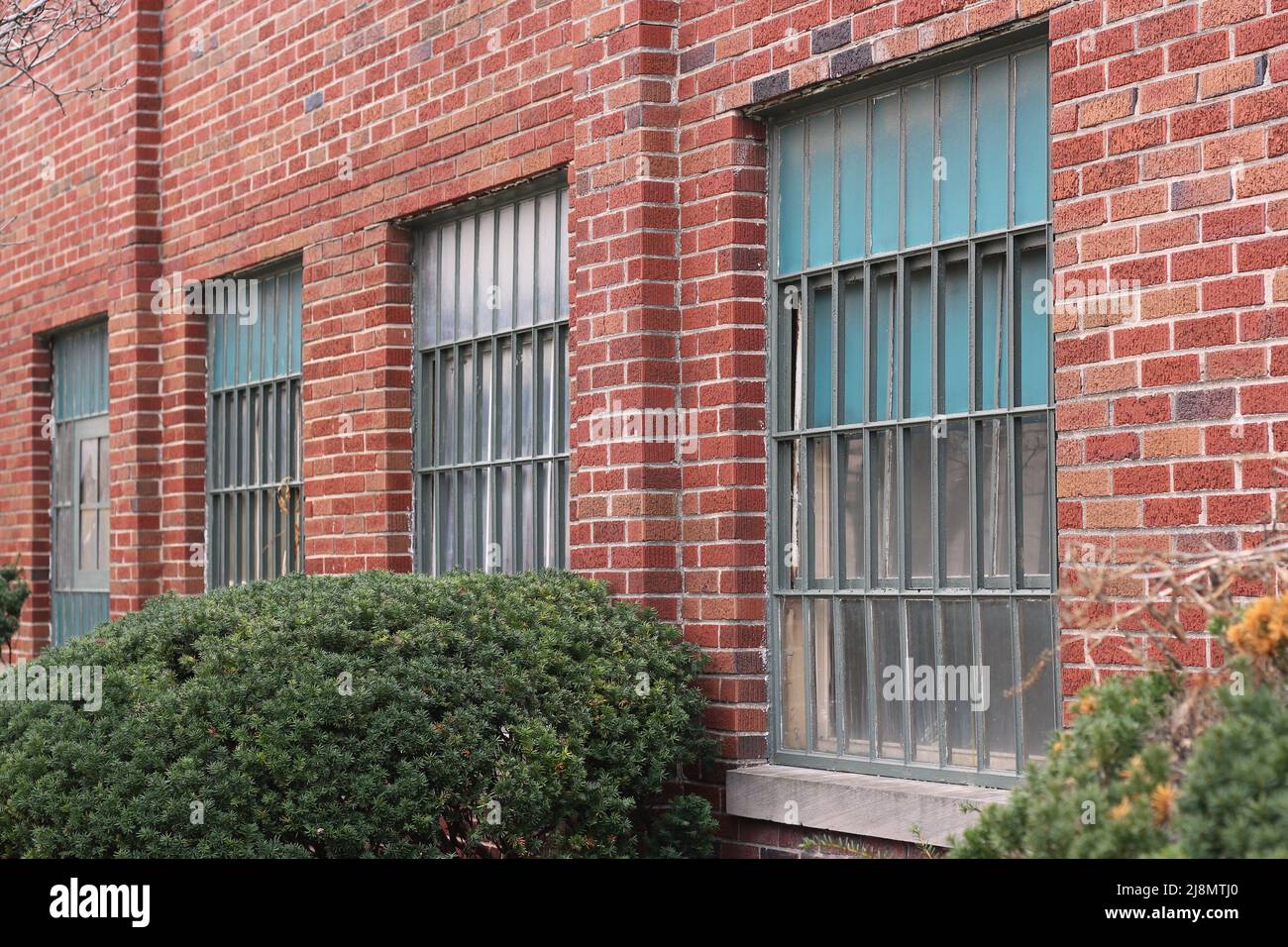 Vintage windows on the wall of an old abandoned factory Stock Photo - Alamy