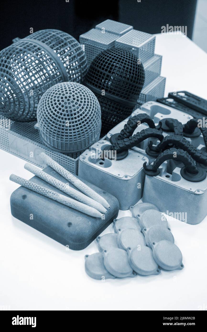 Many models printed on 3D printer. Gray and black objects printed 3D ... Many models printed on 3D printer. Gray and black objects printed 3D ...