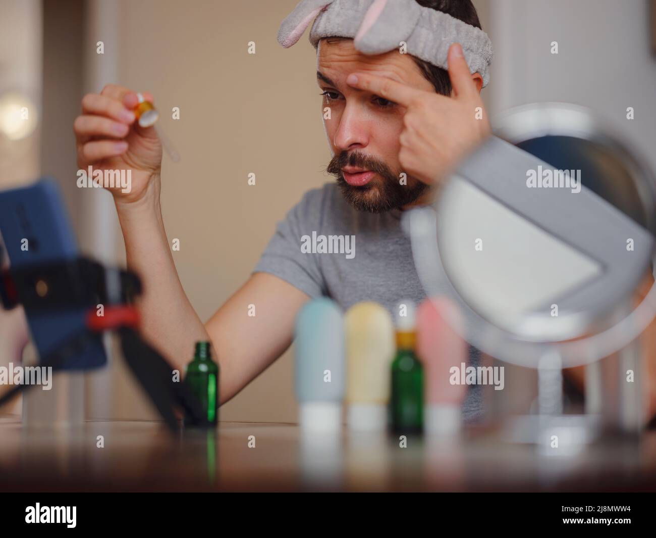 Men's beauty concept. caucAsian guy checking his skin. Beauty blogger ...