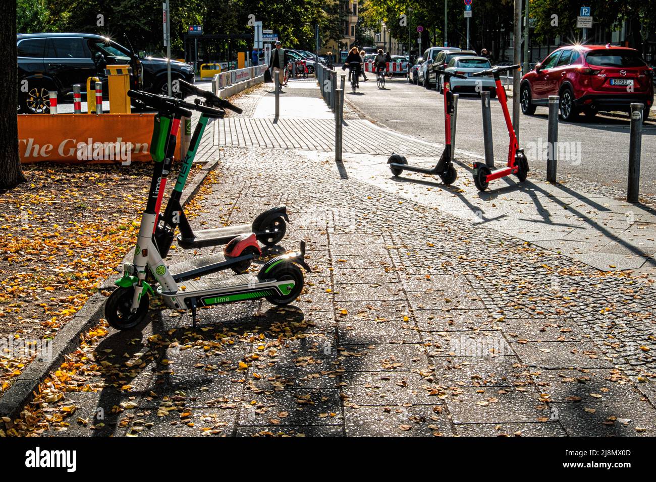 Electric Battery powered e-scooters for hure on a city pavement in ...