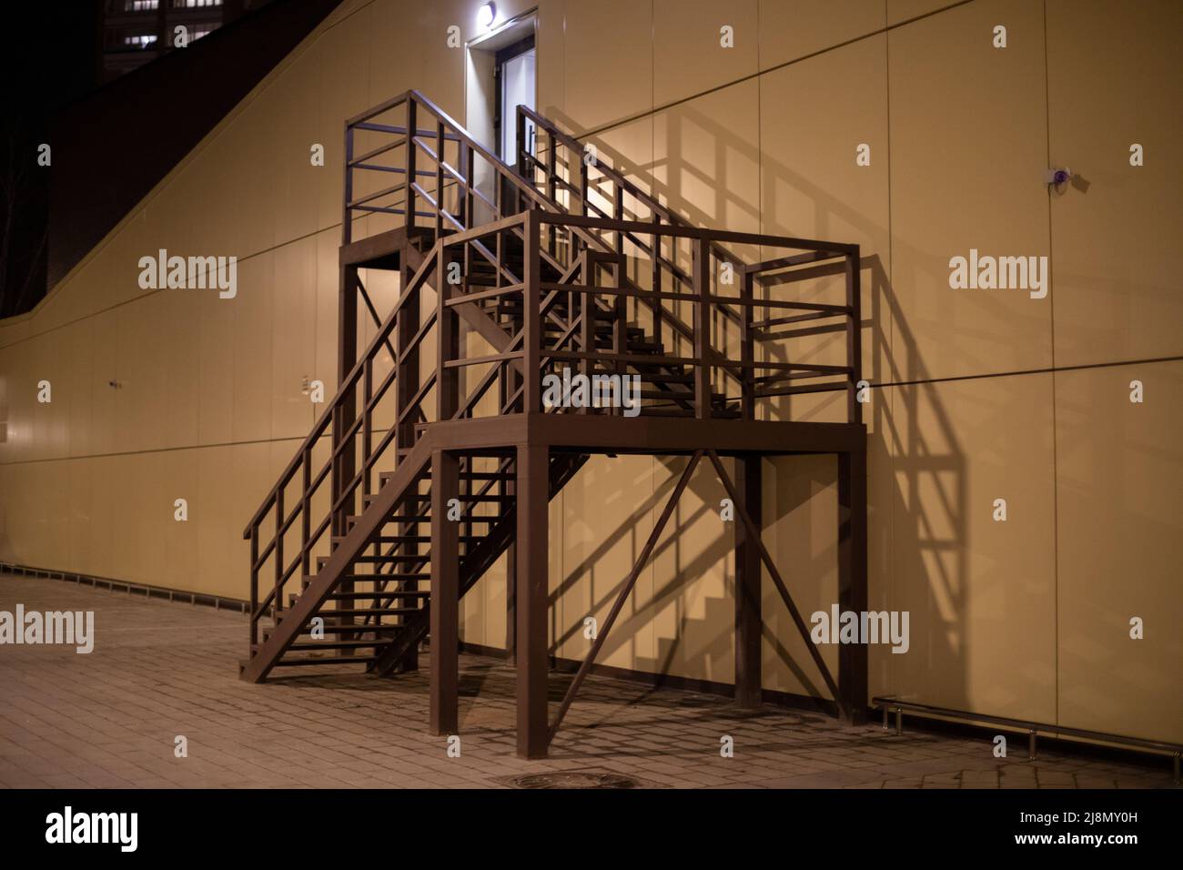 Fire escape in building. Emergency exit from house. Glass staircase ...