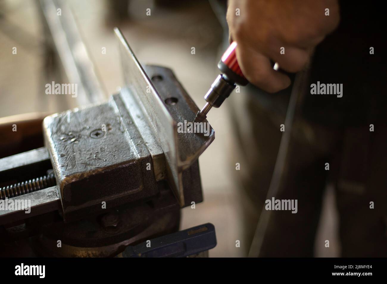 Grinding holes in steel. Removal of excess metal. Create steel part ...