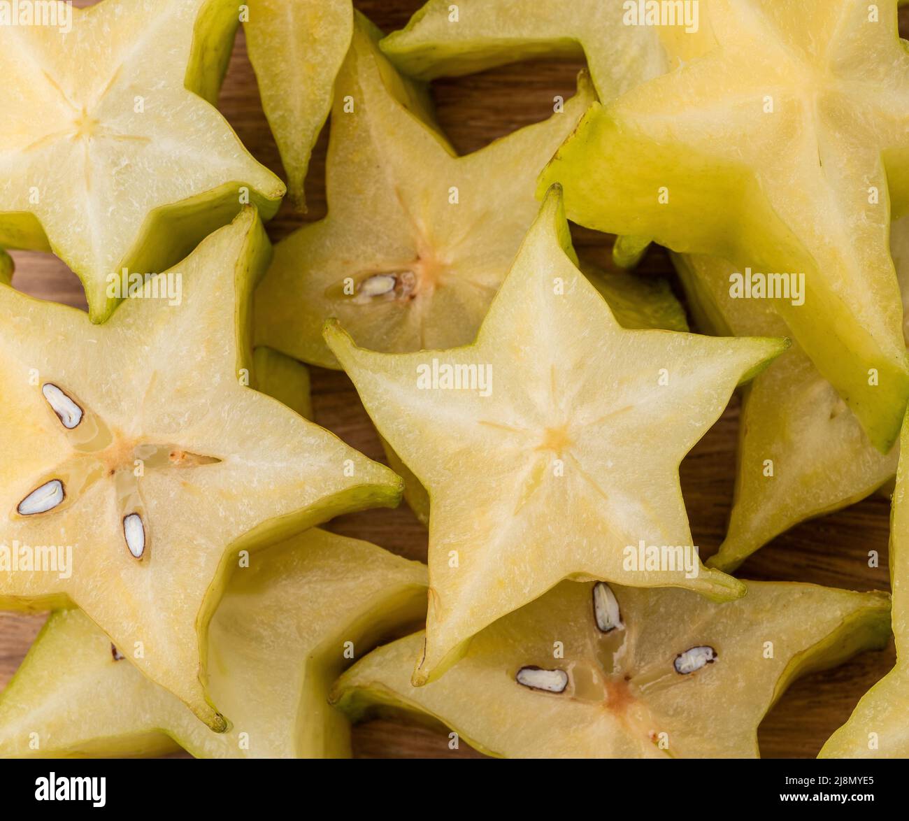 Closeup of a group of starfruit slices. Food backdrop Stock Photo - Alamy