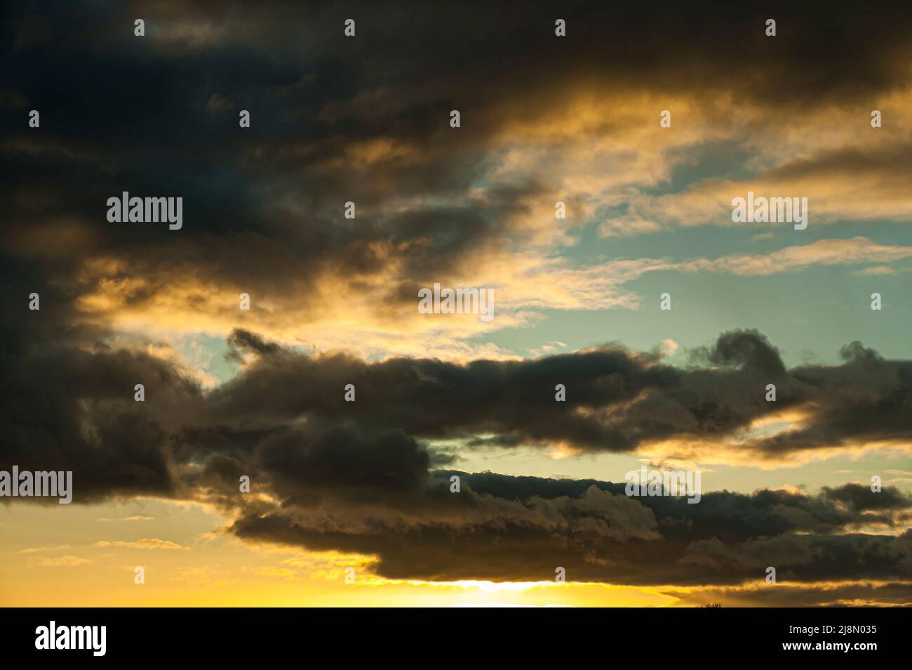 Sunset in springtime with golden light and stormy looking stratocumulus ...