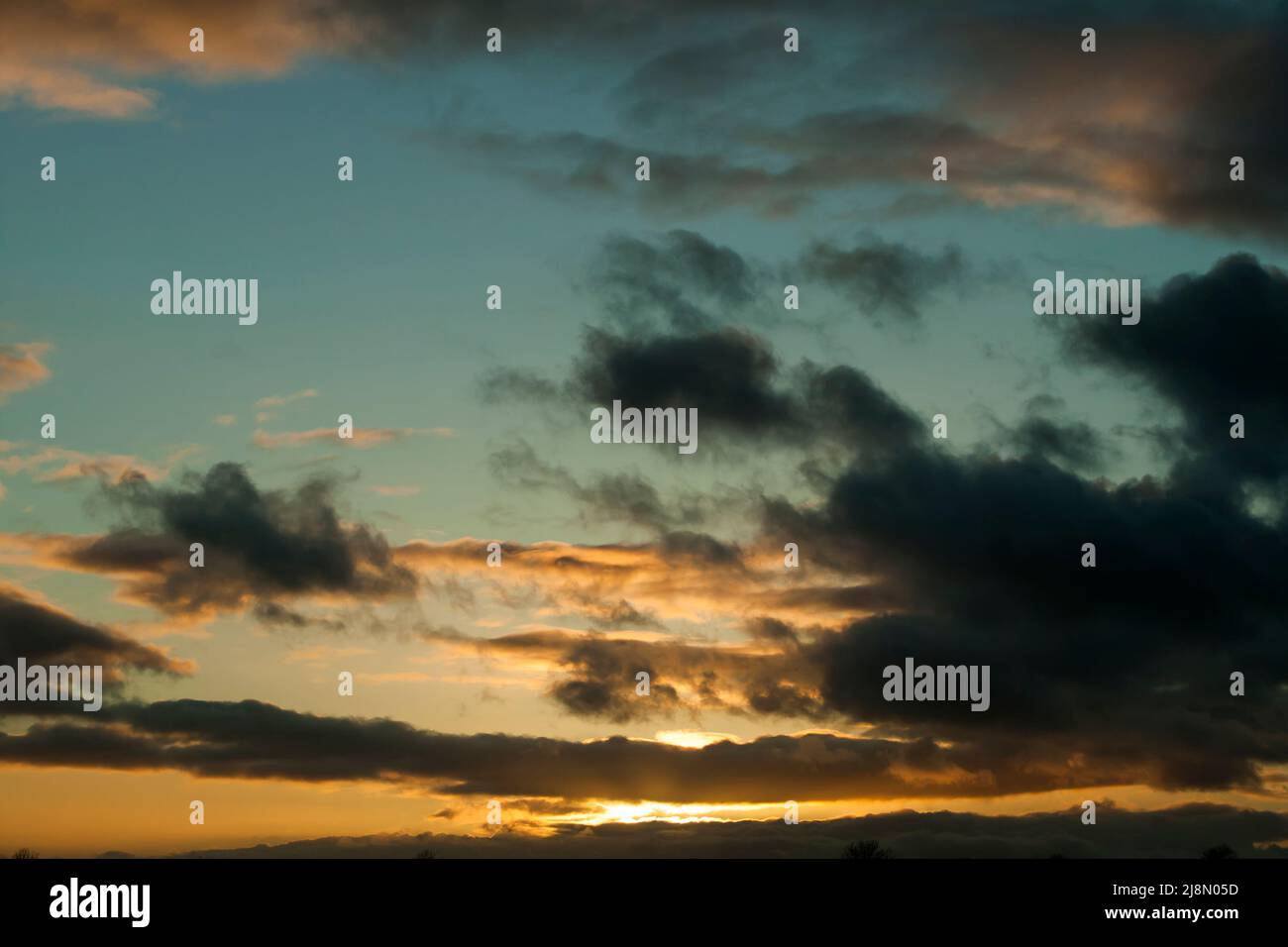 Sunset in springtime with golden light and stormy looking stratocumulus ...