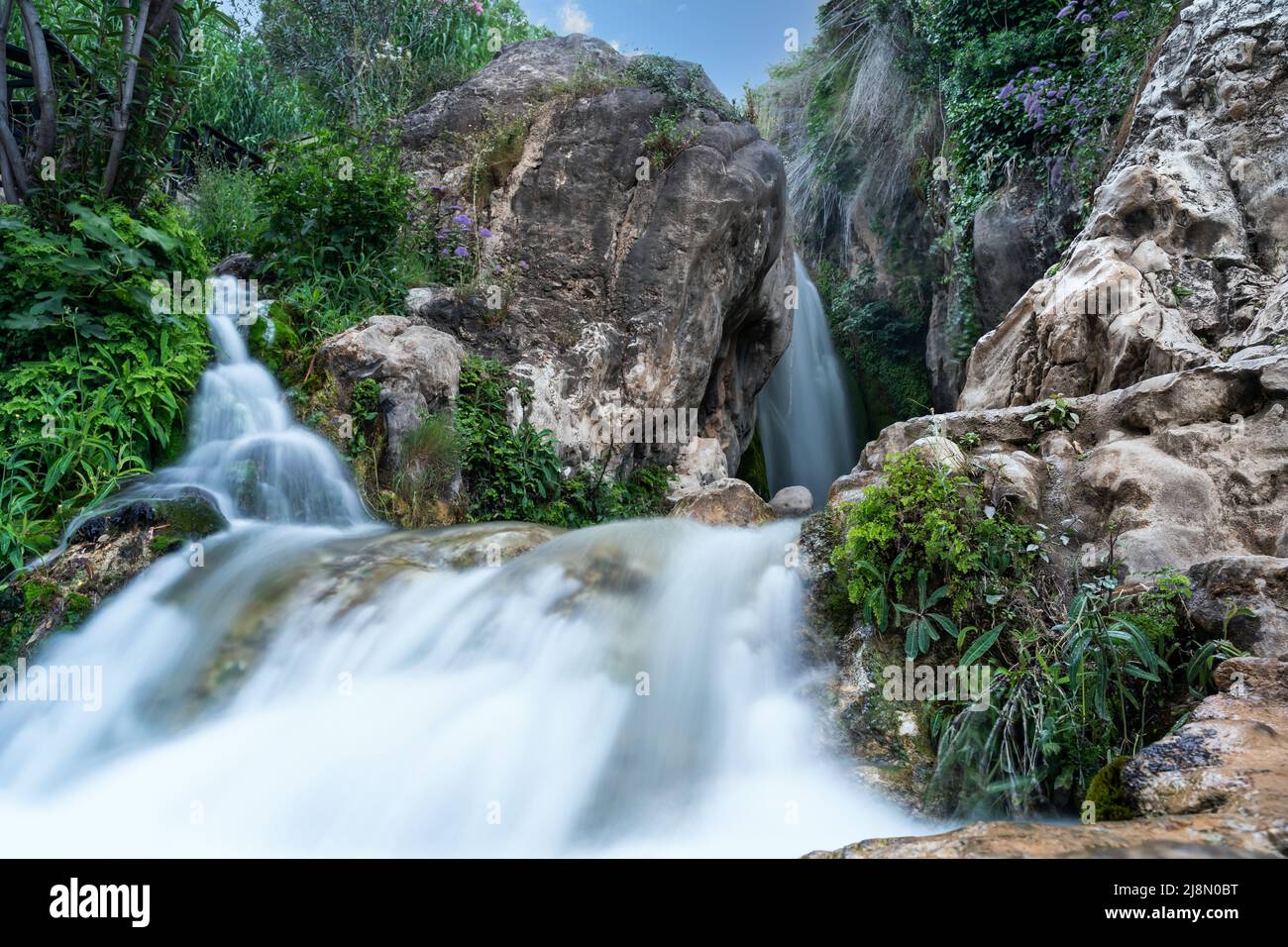 Silky waterfalls among wild vegetation in Callosa den Sarria, Alicante ...