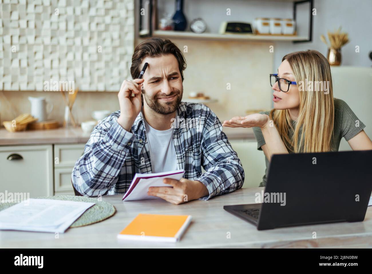 Thoughtful Caucasian Millennial Man With Stubble And Blonde Wife In