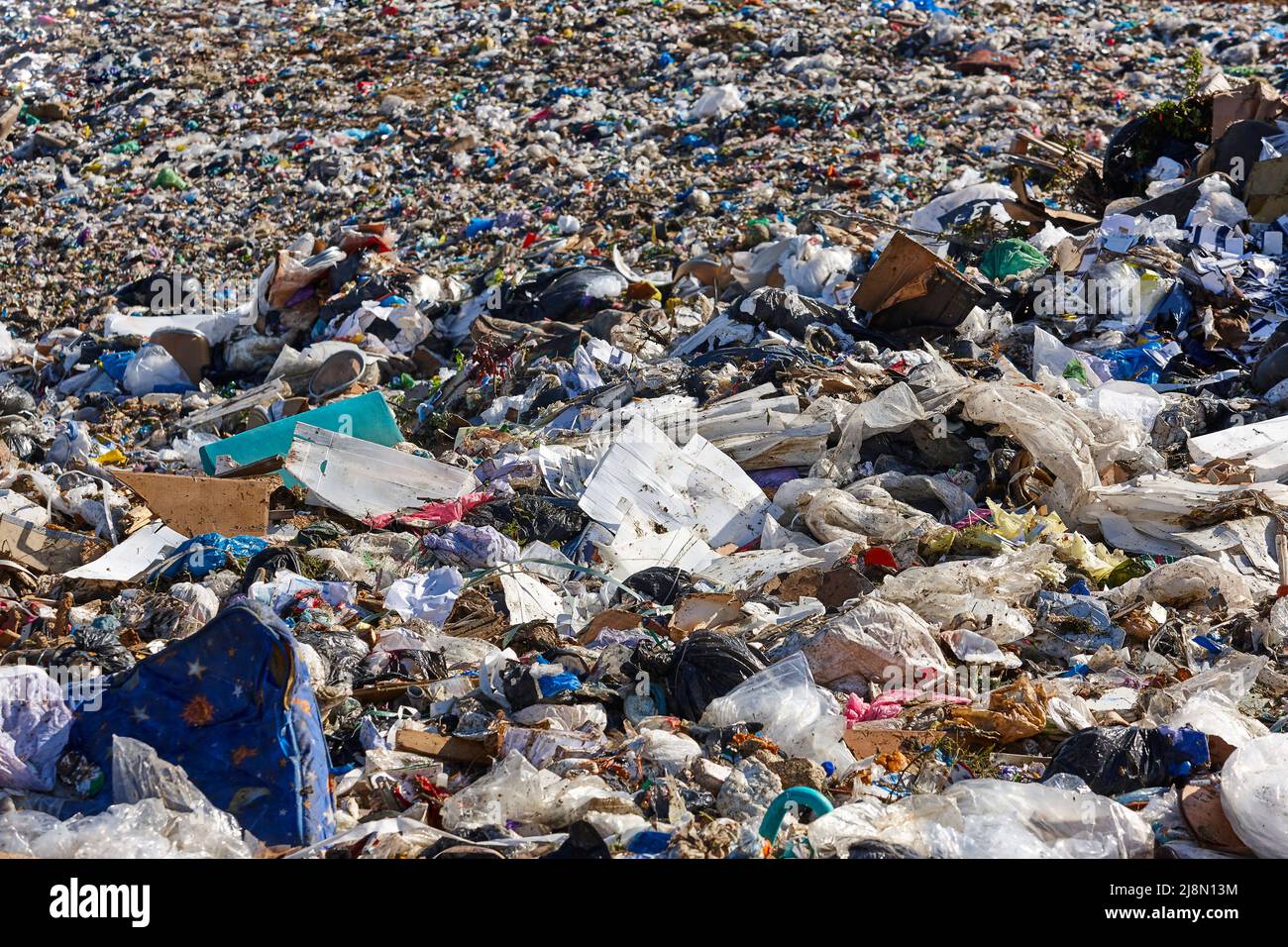 Open air garbage dump. Plastic pollution. Recycling junk. Consumerism ...