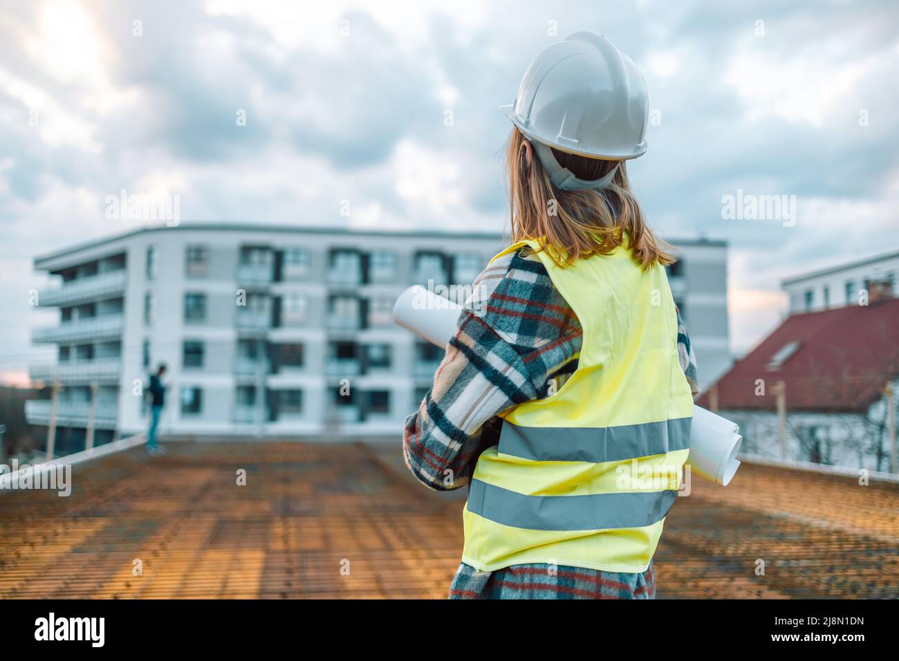 Female construction worker under inspection and checking standing on ...