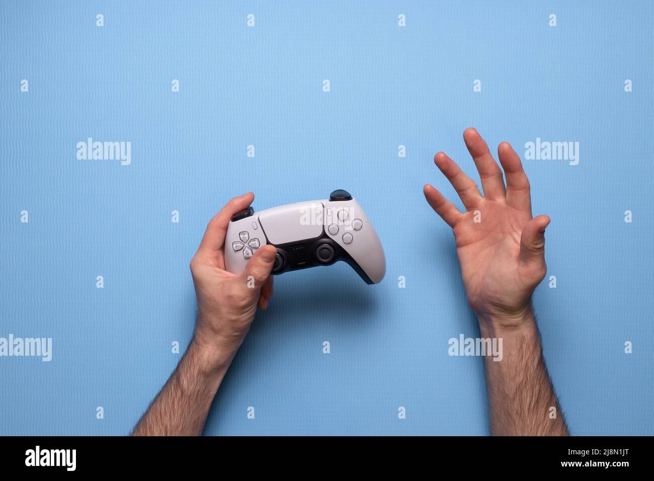 Hand hold new joystick. Gamer play game with gamepad controller. Gaming ...