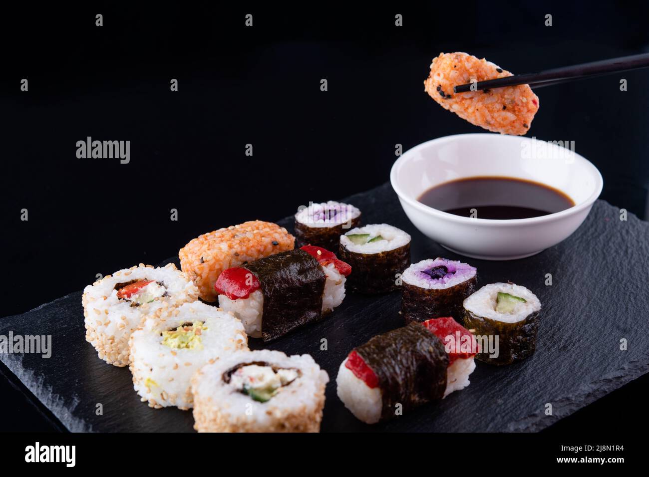 Close up of delicious japanese food with vegetarion sushi rolls with ...