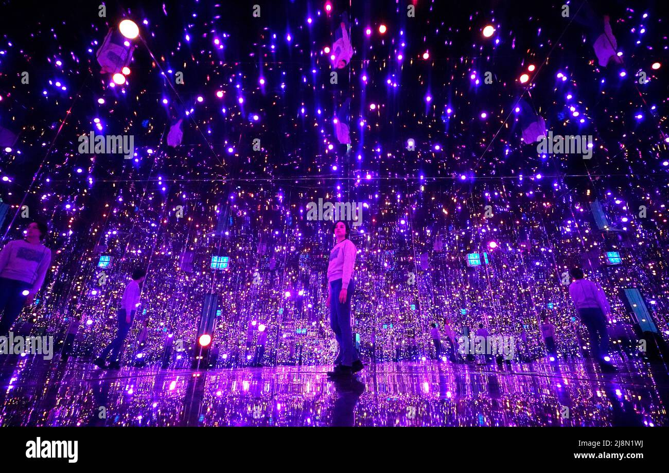 Guide Daniela Spigno in an infinity room which forms part of Van Gogh ...
