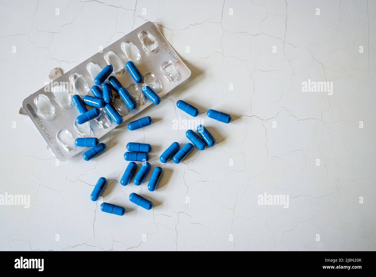 Pile of blue tablets pills Stock Photo - Alamy