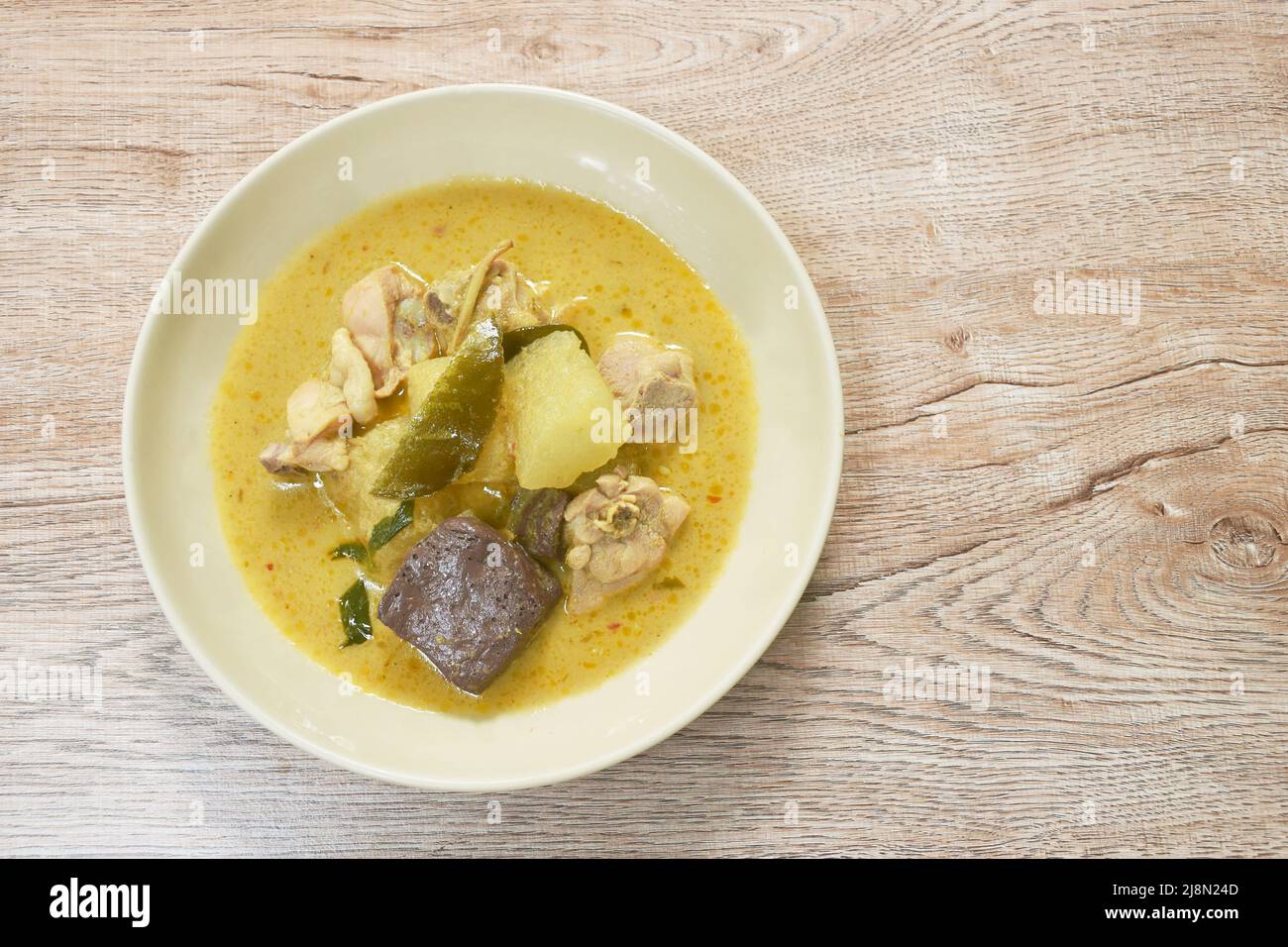 spicy boiled slice winter melon with chicken and blood in coconut milk ...