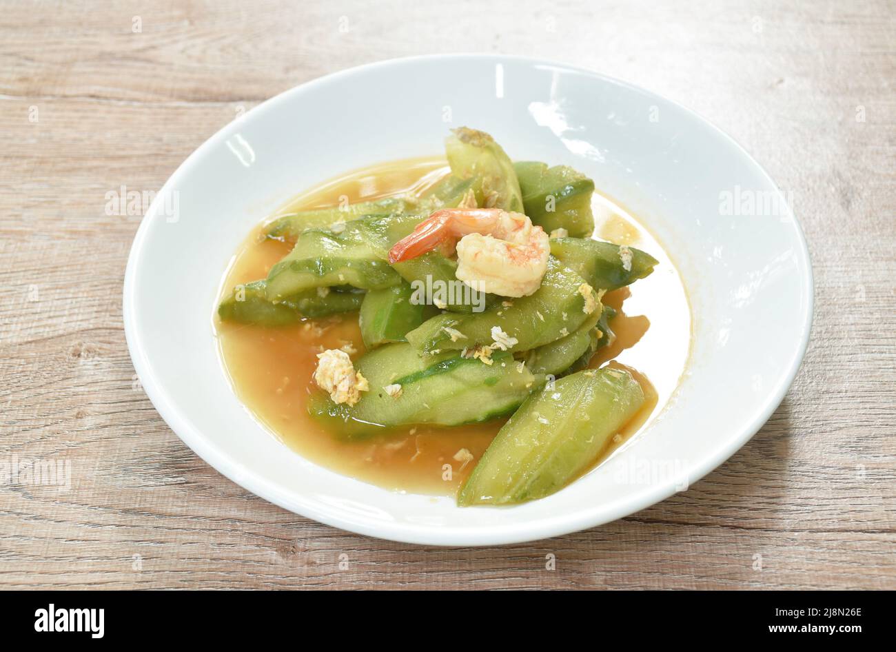 stir fried ridge gourd with egg and shrimp on dish Stock Photo - Alamy