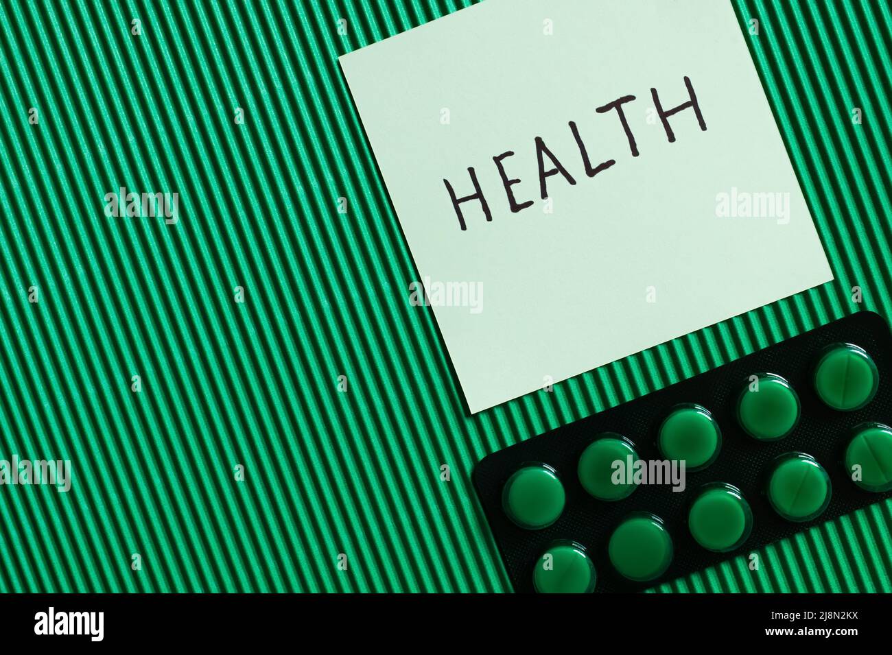 top view of blister pack with pills near paper note with health ...