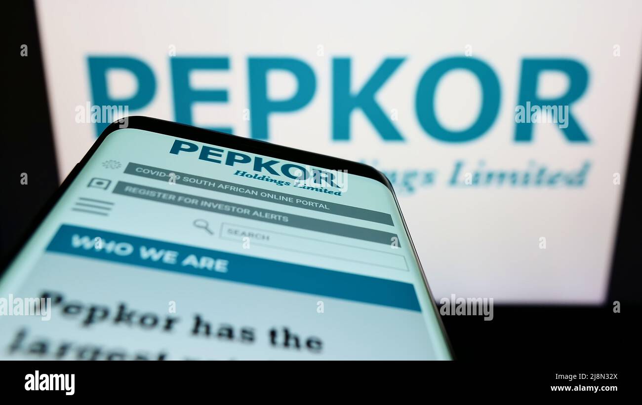 Mobile phone with website of South African company Pepkor Holdings ...