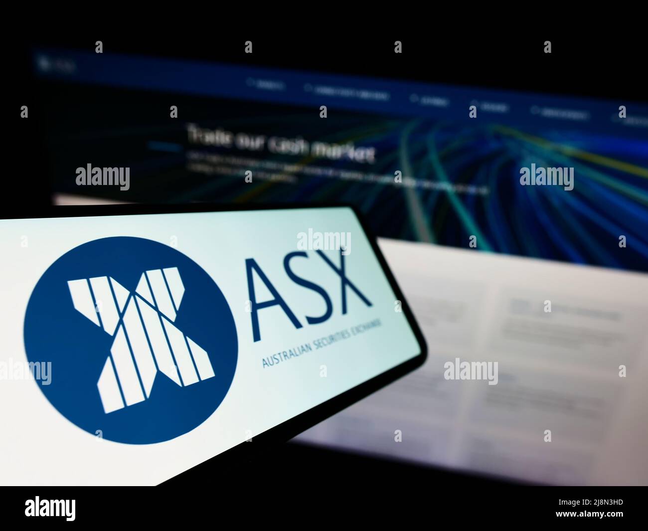 Mobile phone with logo of Australian Securities Exchange Ltd (ASX) on ...