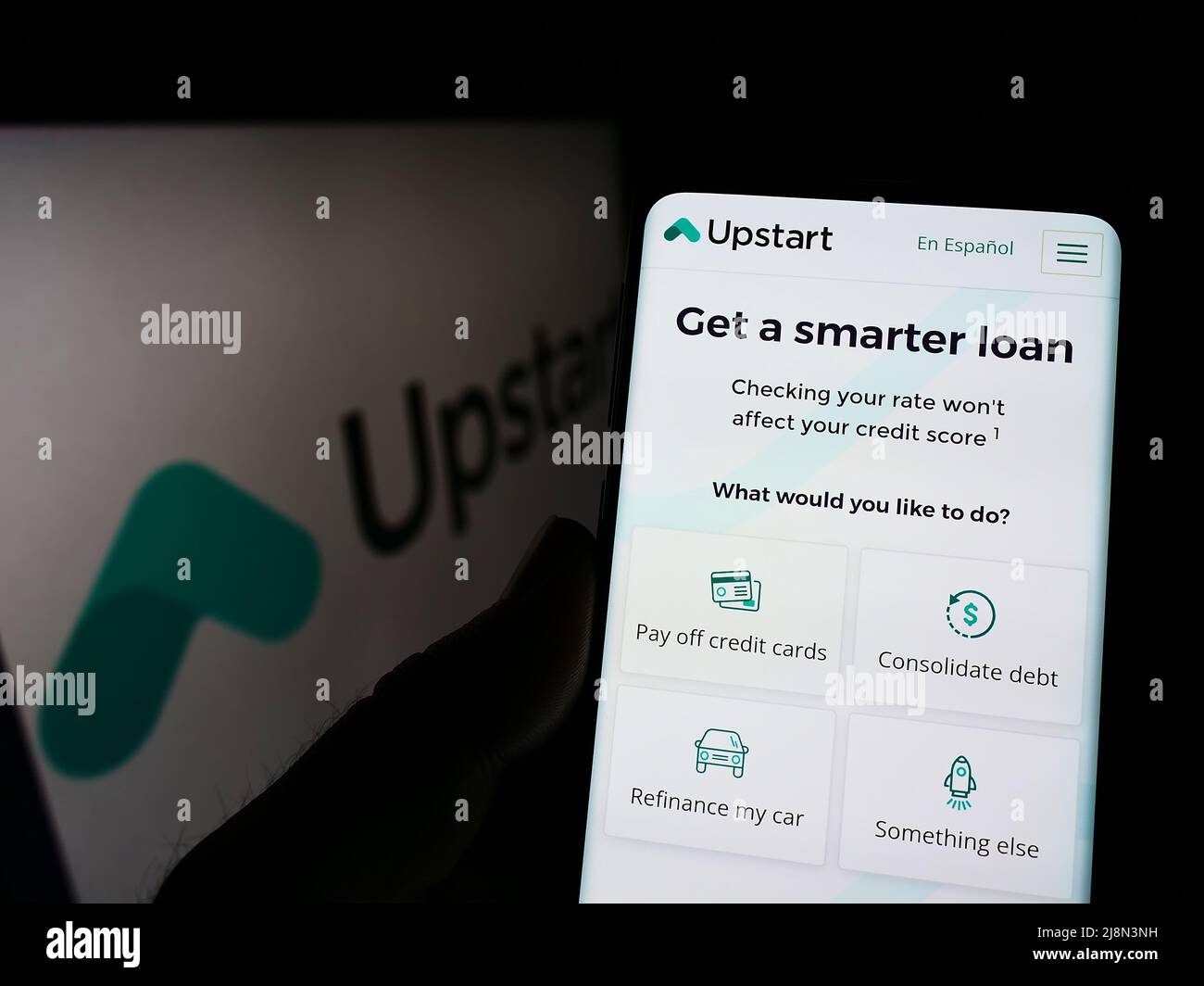 Person holding smartphone with webpage of US fintech company Upstart ...