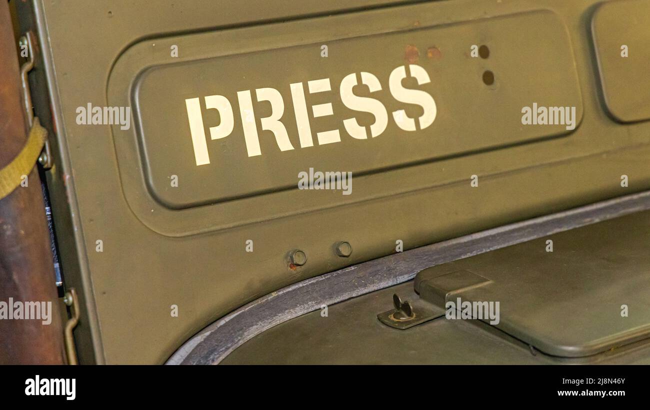 Stencil Press Sign at Green Journalist Vehicle Stock Photo - Alamy