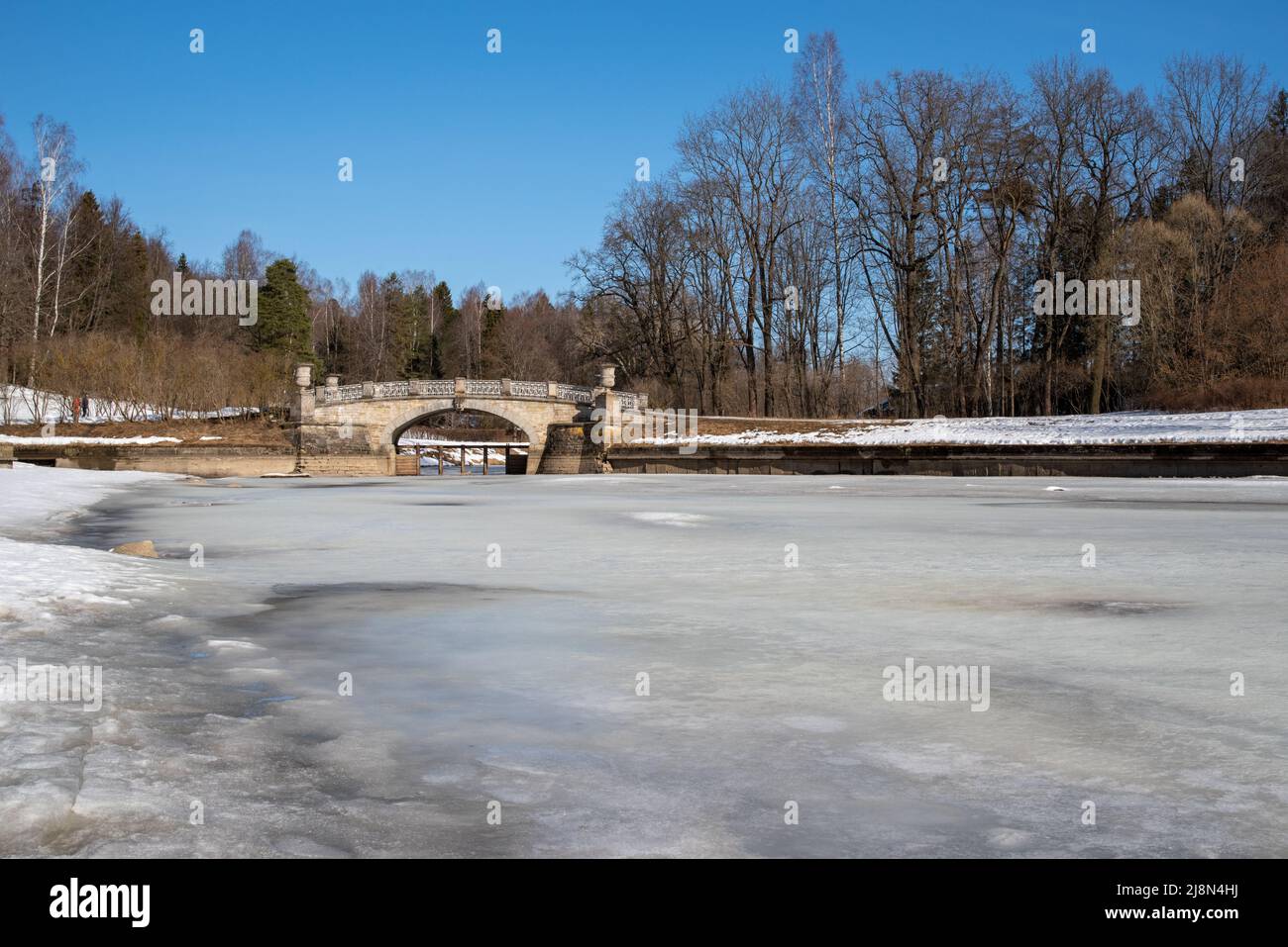 Vintage Viskontiev bridge over Slavyanka river. The spring landscape ...