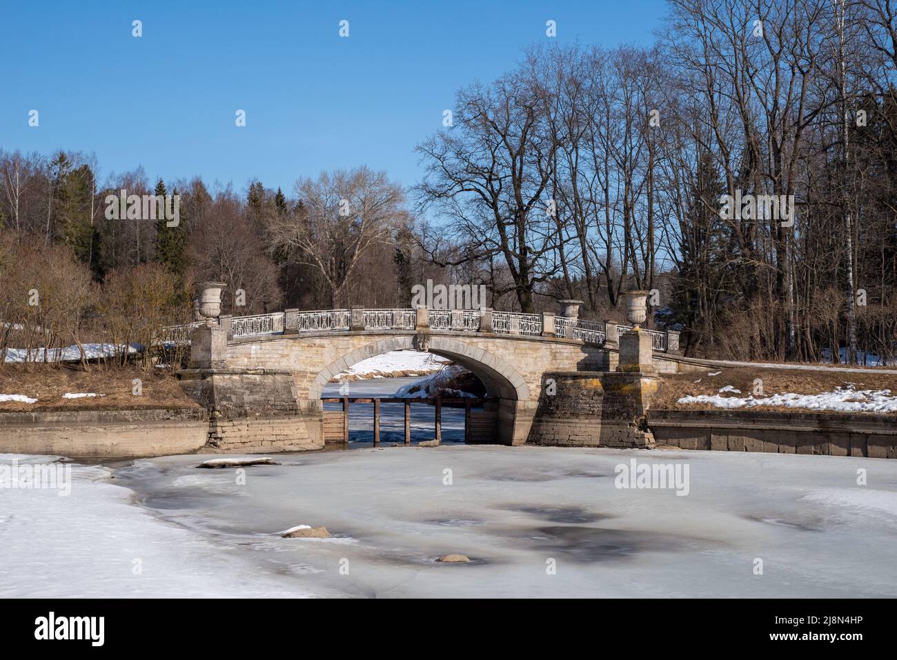 Vintage Viskontiev bridge over Slavyanka river. The spring landscape ...