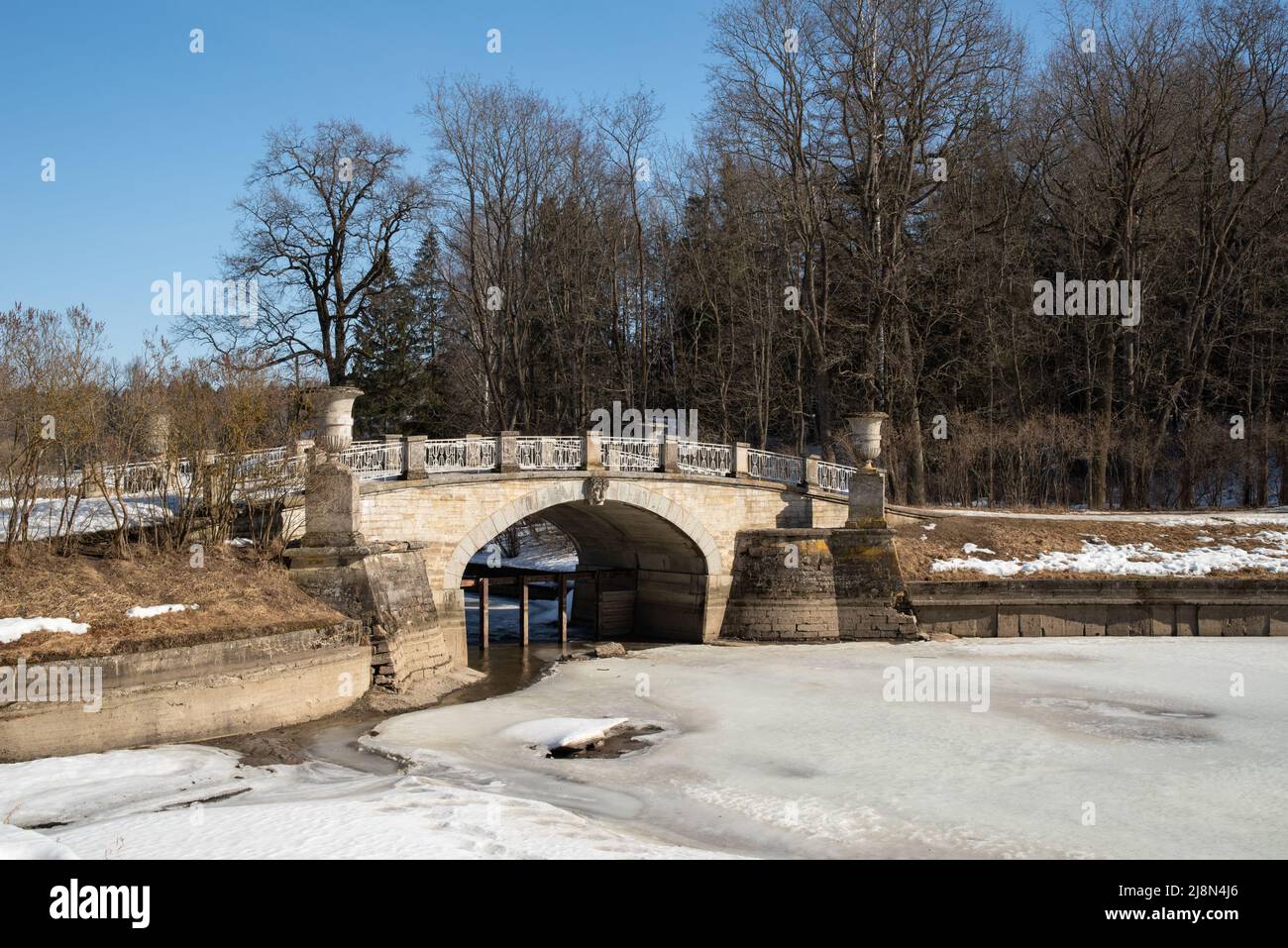 Vintage Viskontiev bridge over Slavyanka river. The spring landscape ...
