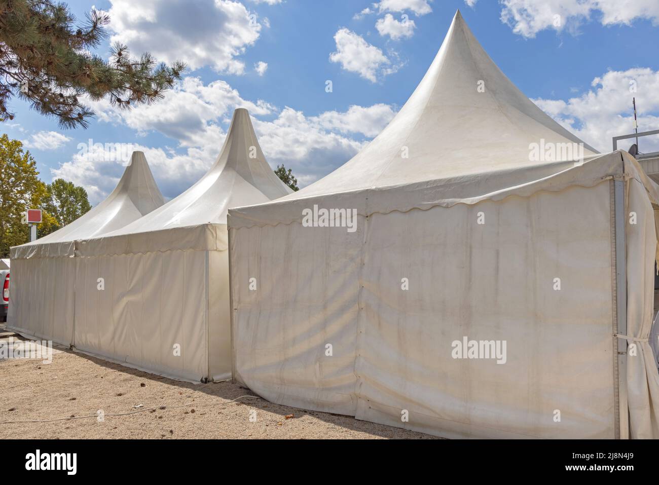 White Plastic Tents Canopy in Row For Outdoor Events Stock Photo - Alamy