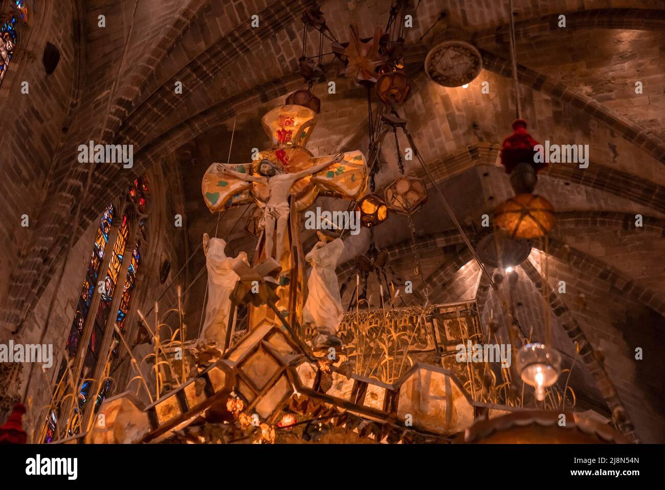 Low angle view of Jesus Christ and angels statue hanging over altar in ...