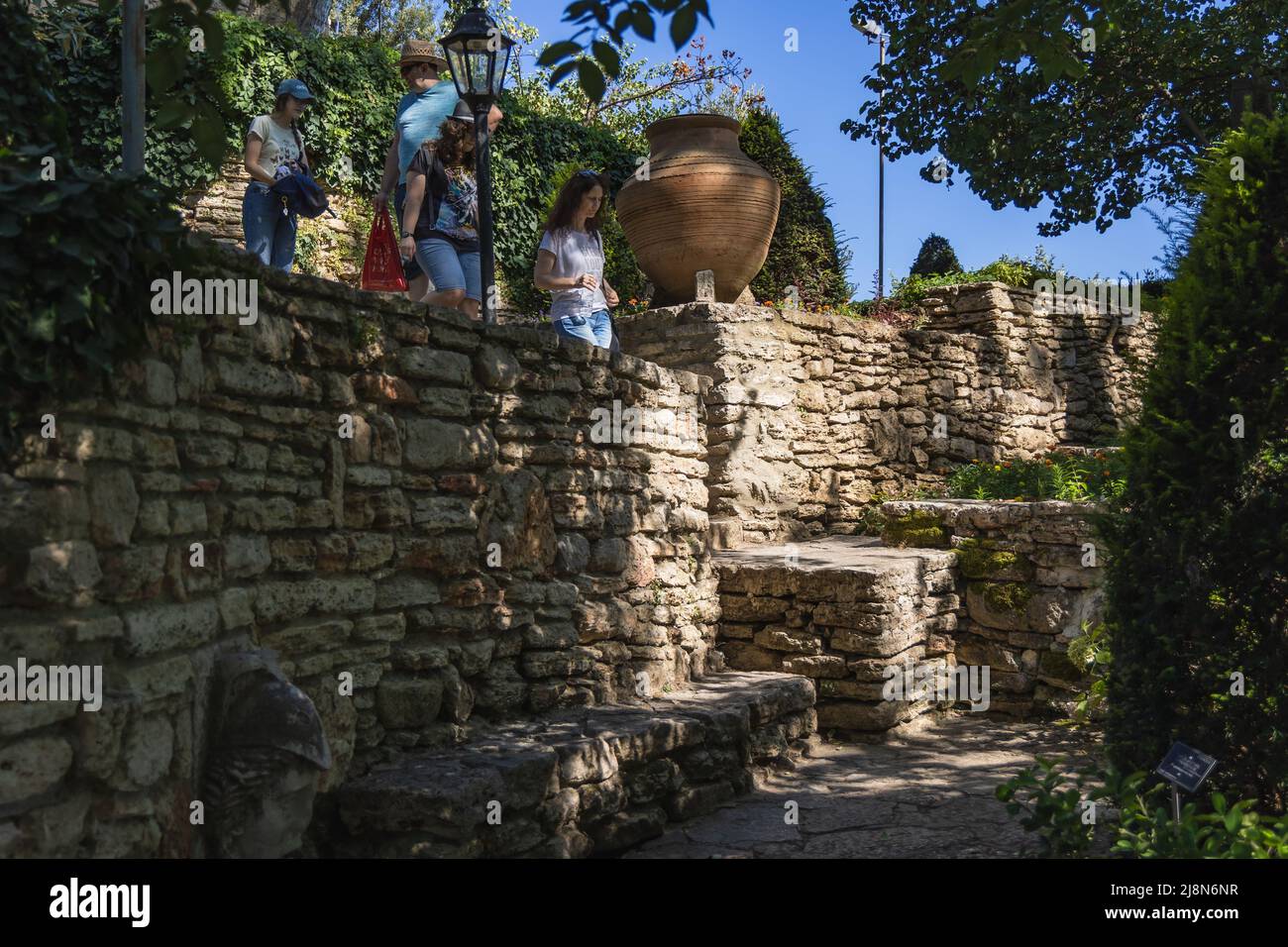 Tourists in The Palace architectural park and Botanical garden complex ...